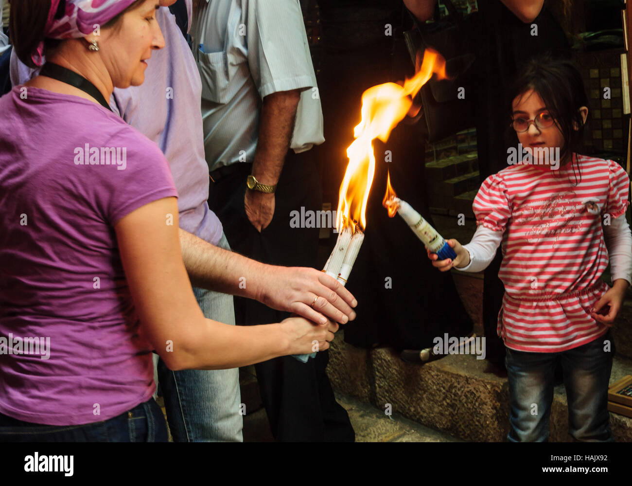 JERUSALEM - APRIL 19, 2014: The holy fire from the holy fire ceremony ...