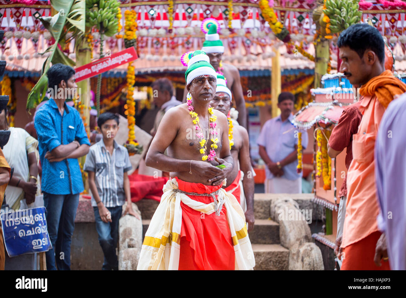 Participants of Ezhamkulam thookam festival coming out of temple for ...