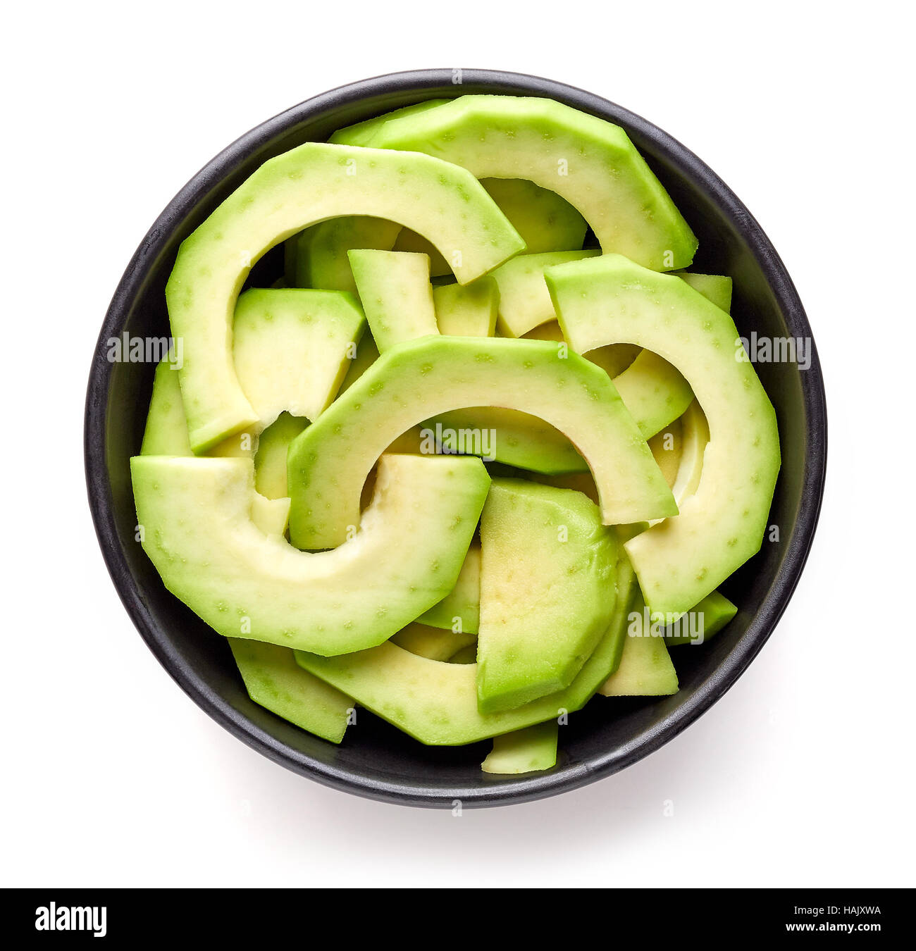 Bowl of avocado slices isolated on white background, top view Stock ...
