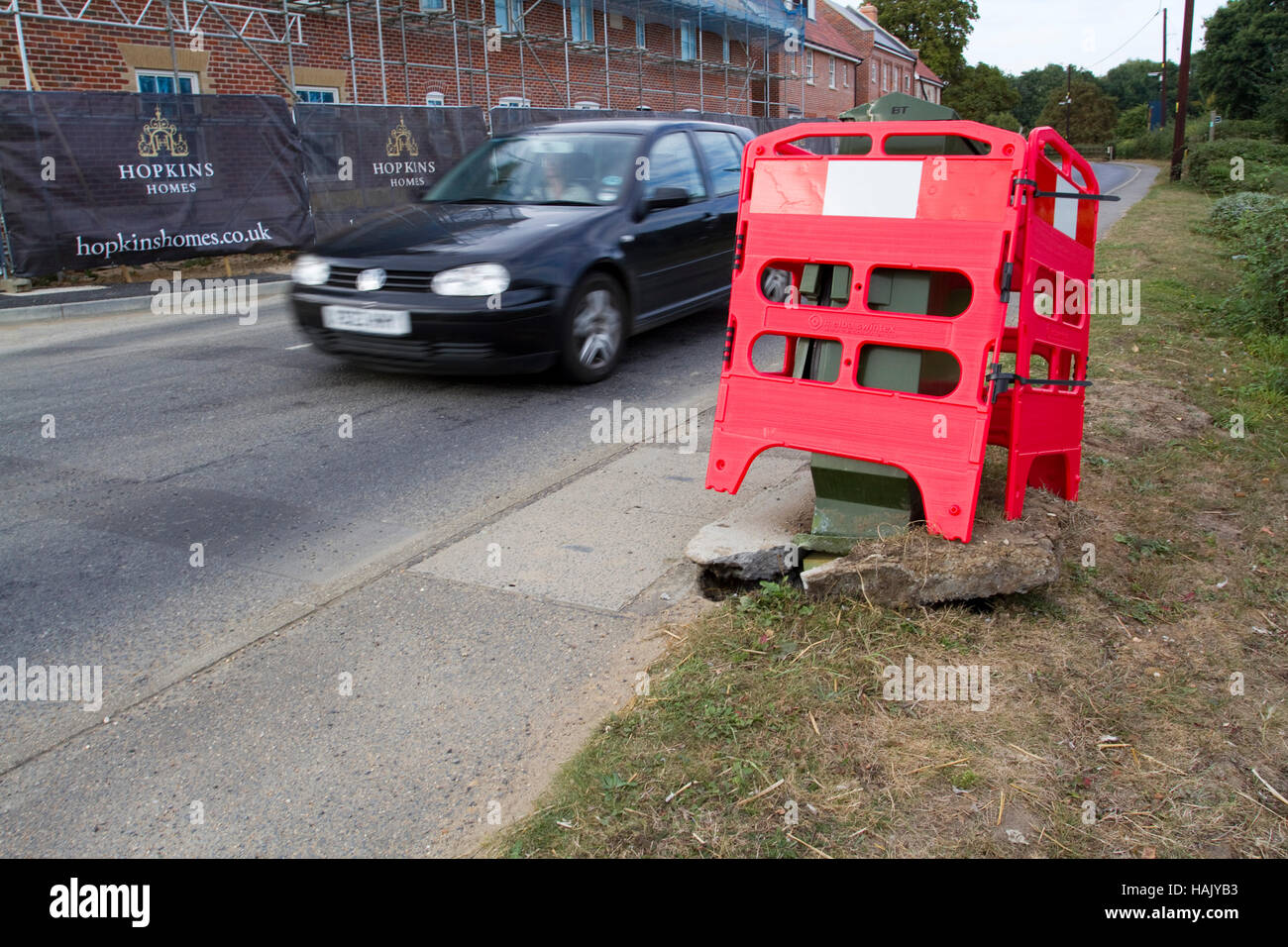 A British Telecoms green box that has been hit hard enough to knock it ...