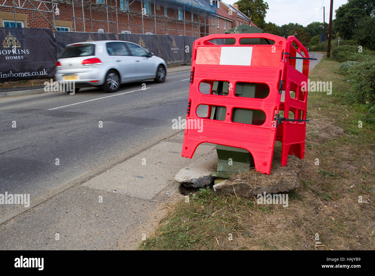 A British Telecoms green box that has been hit hard enough to knock it ...