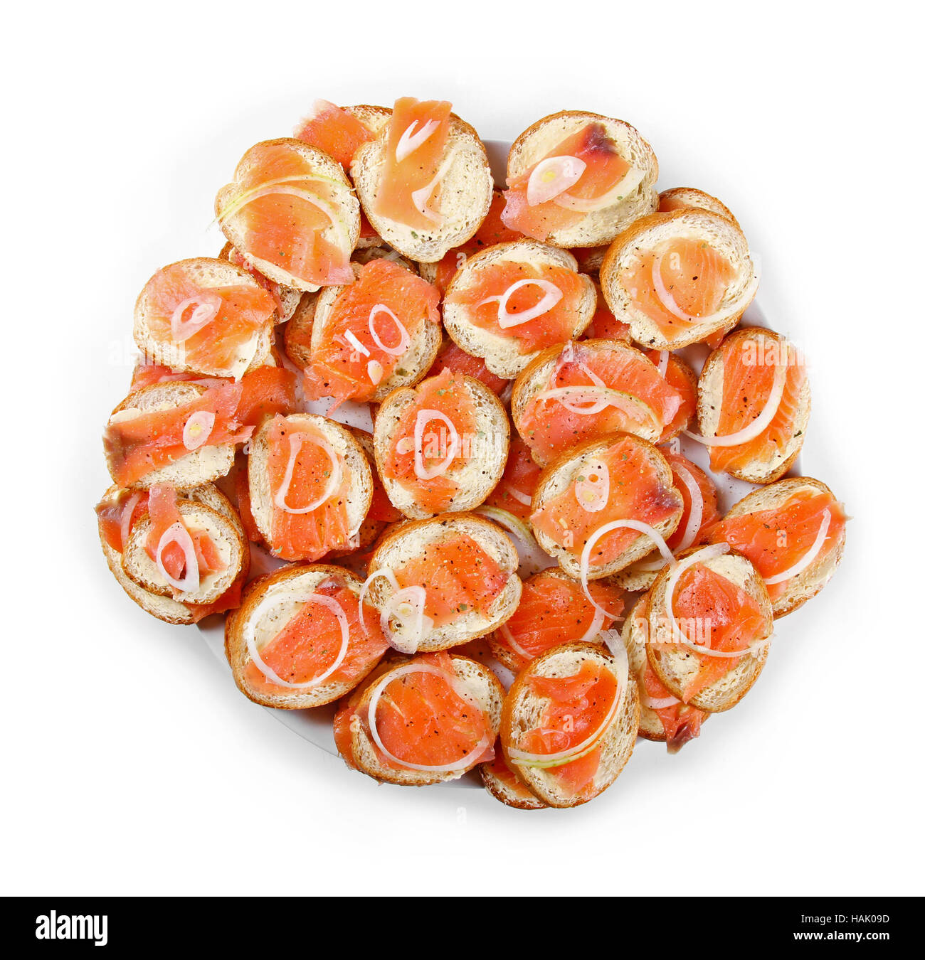 salmon snacks on dish isolated on white Stock Photo - Alamy