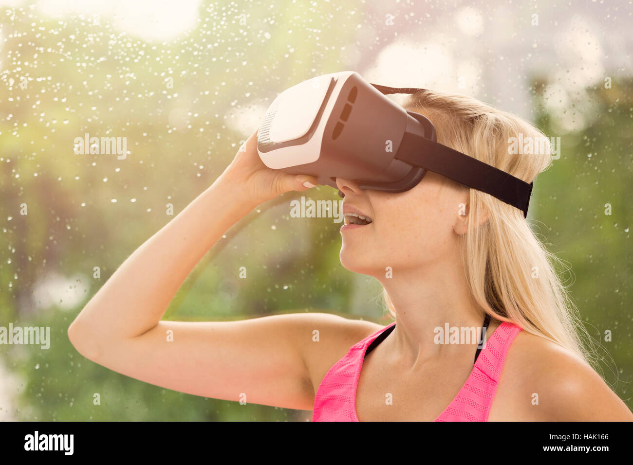 young woman feeling excited for using virtual reality headset Stock ...