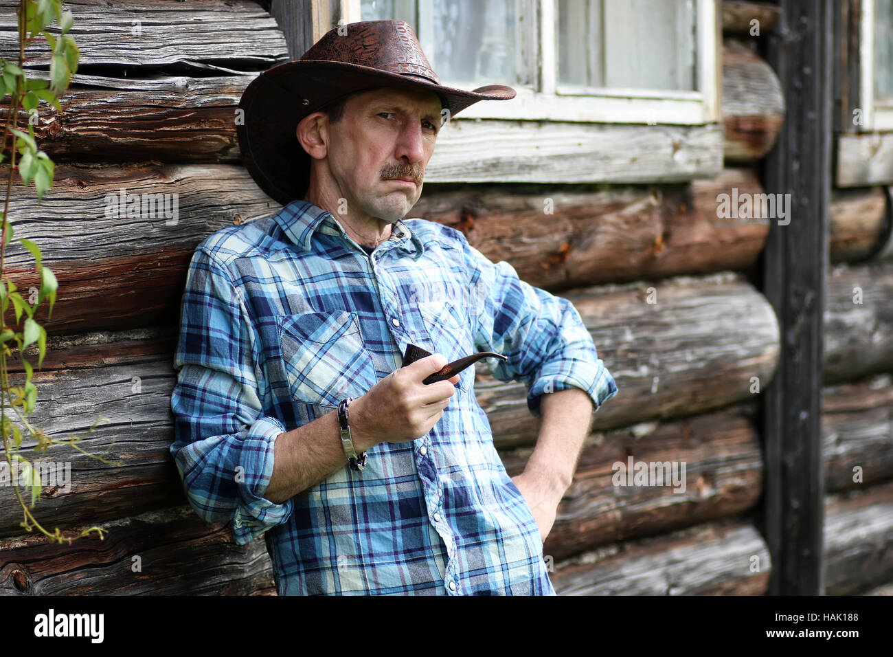 cowboy man smoke pipe Stock Photo - Alamy