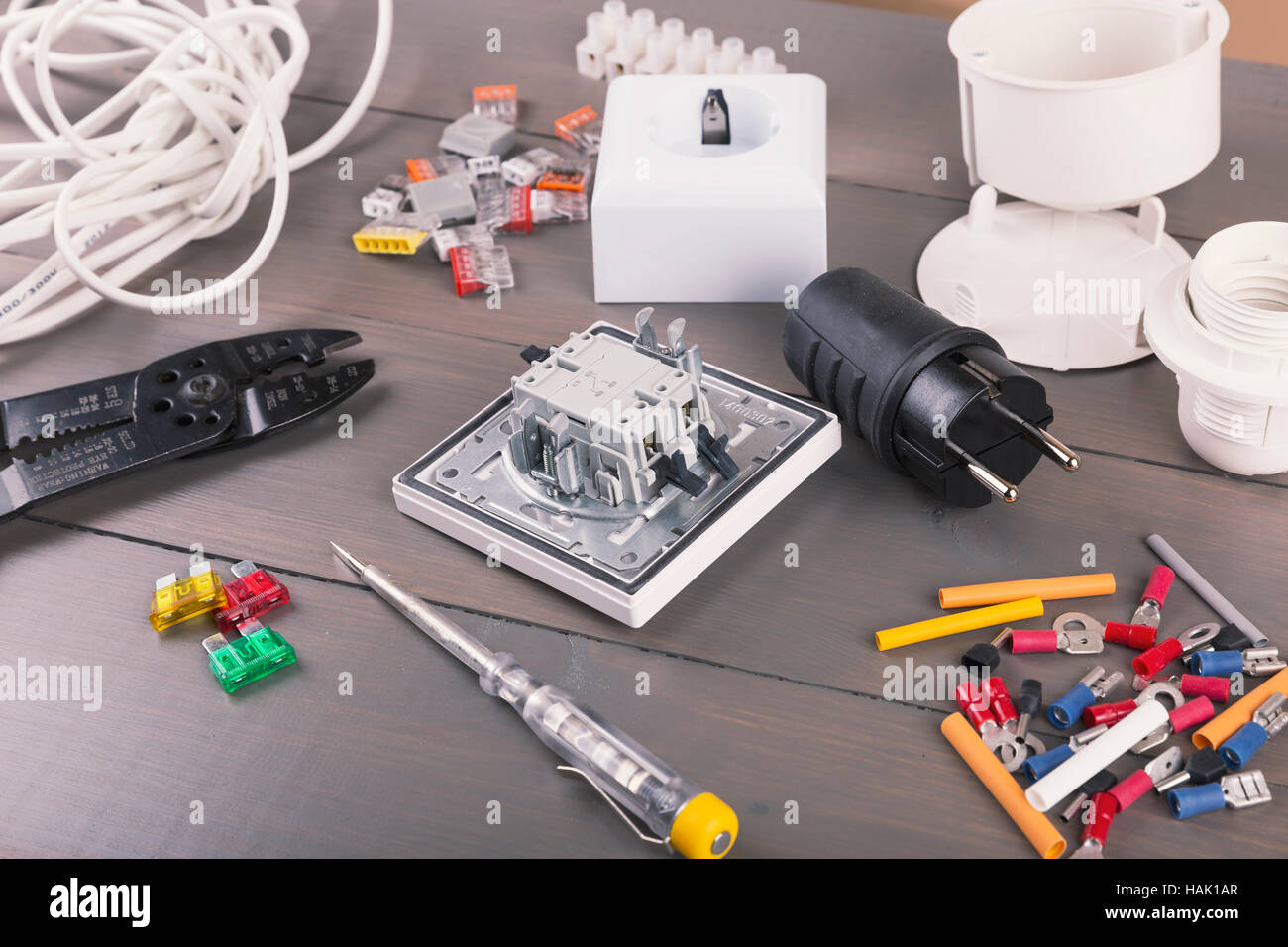 electrician tools and accessories on wooden table Stock Photo - Alamy