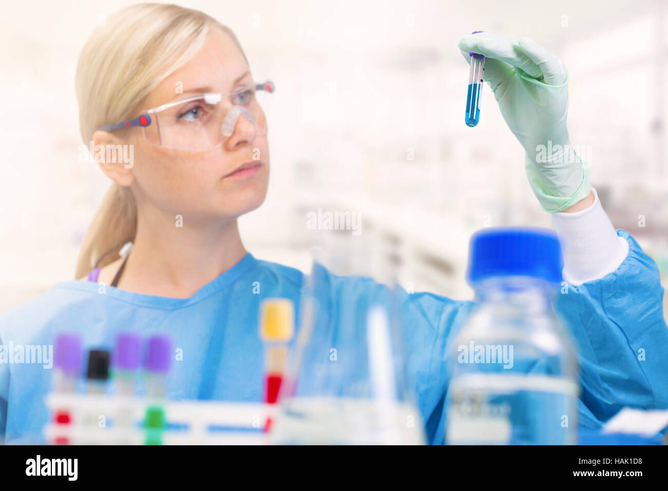 scientist working with analysis samples in a laboratory. focus on test ...