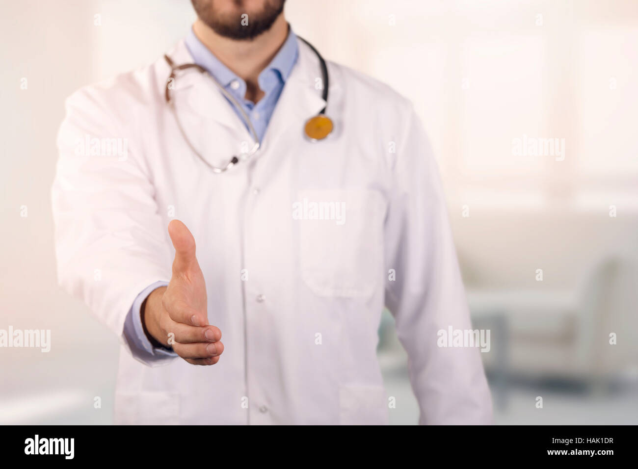 friendly doctor giving hand for handshake Stock Photo - Alamy