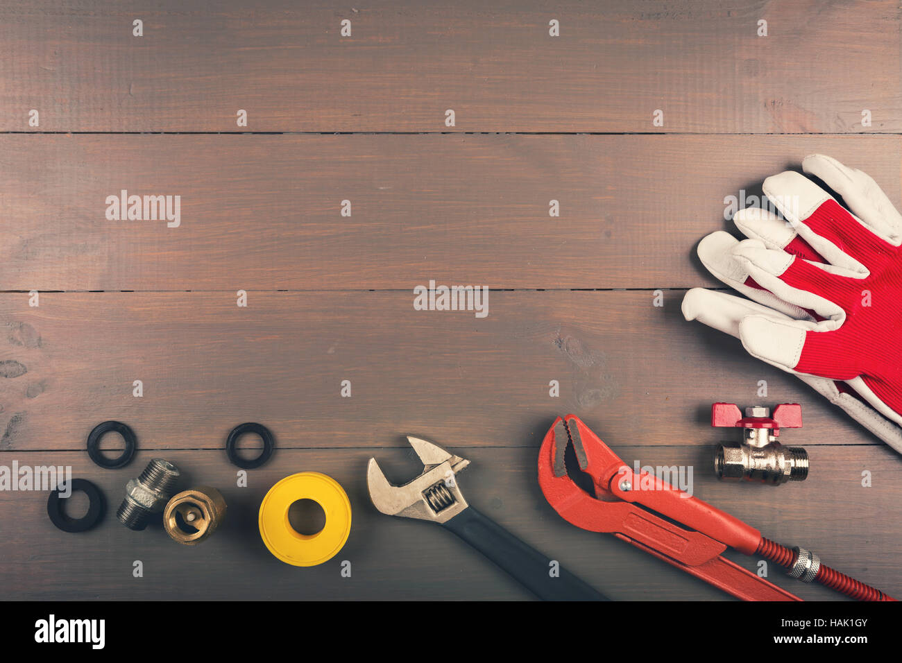 plumbing tools on wooden table with copyspace Stock Photo - Alamy