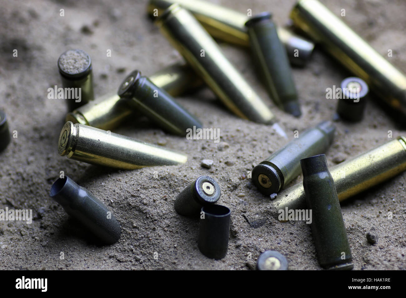 bullet in the sand Stock Photo - Alamy