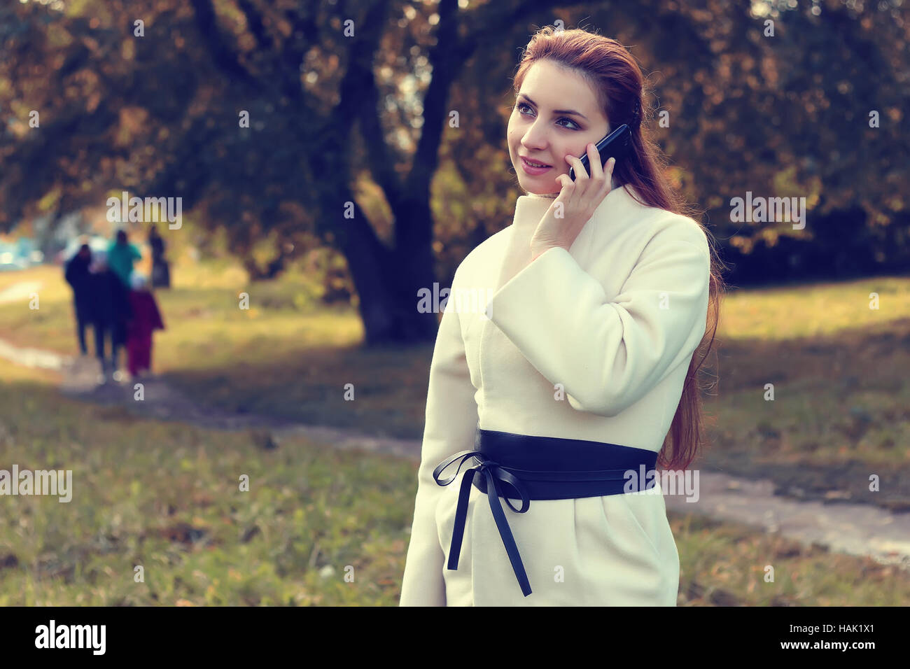 girl in a park walk autumn alone Stock Photo - Alamy
