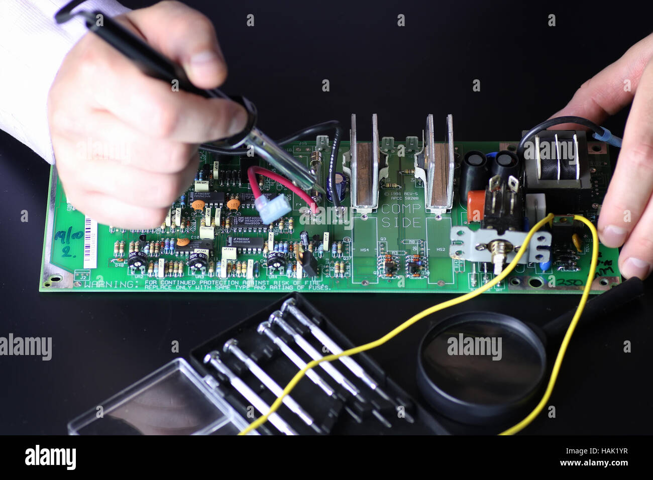 man hands chip soldering tools Stock Photo - Alamy