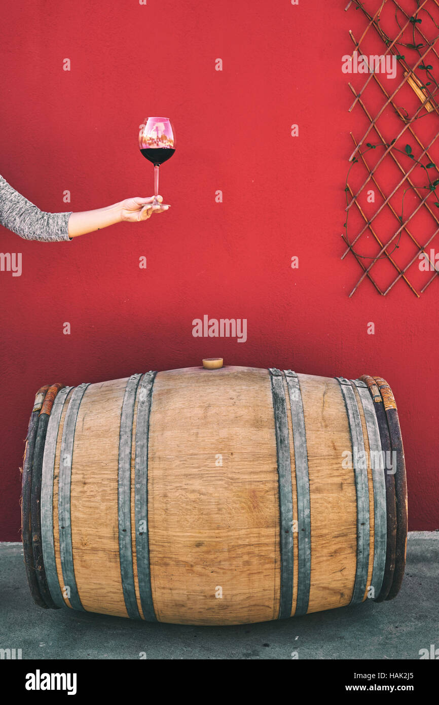 Winemaker getting sample of red wine from barrel Stock Photo - Alamy