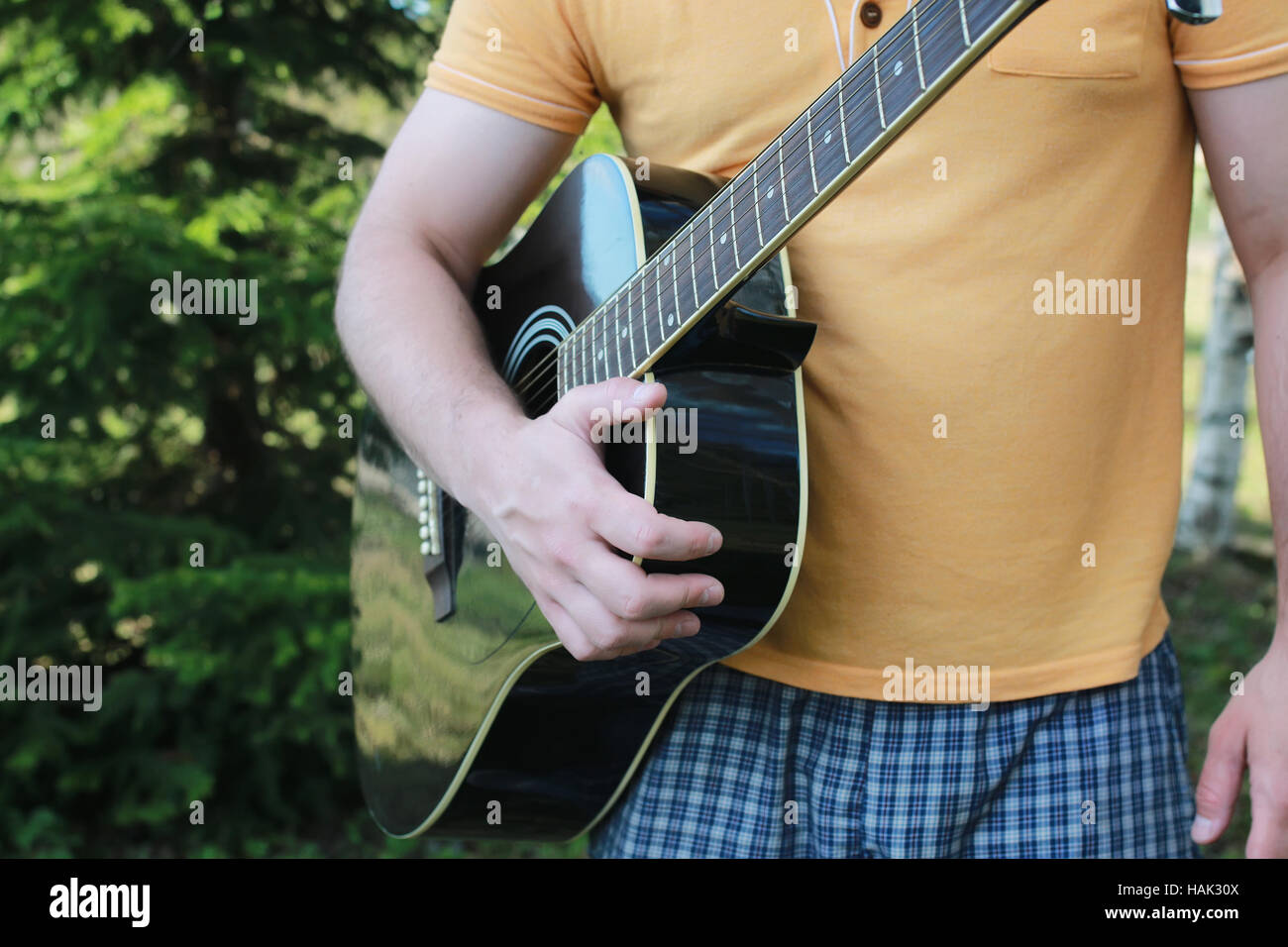 guitar string man hand outdoor Stock Photo - Alamy