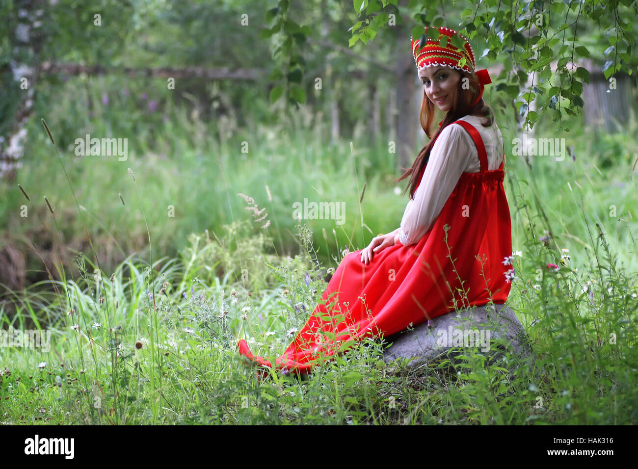 Slav in traditional dress is sitting in nature Stock Photo - Alamy