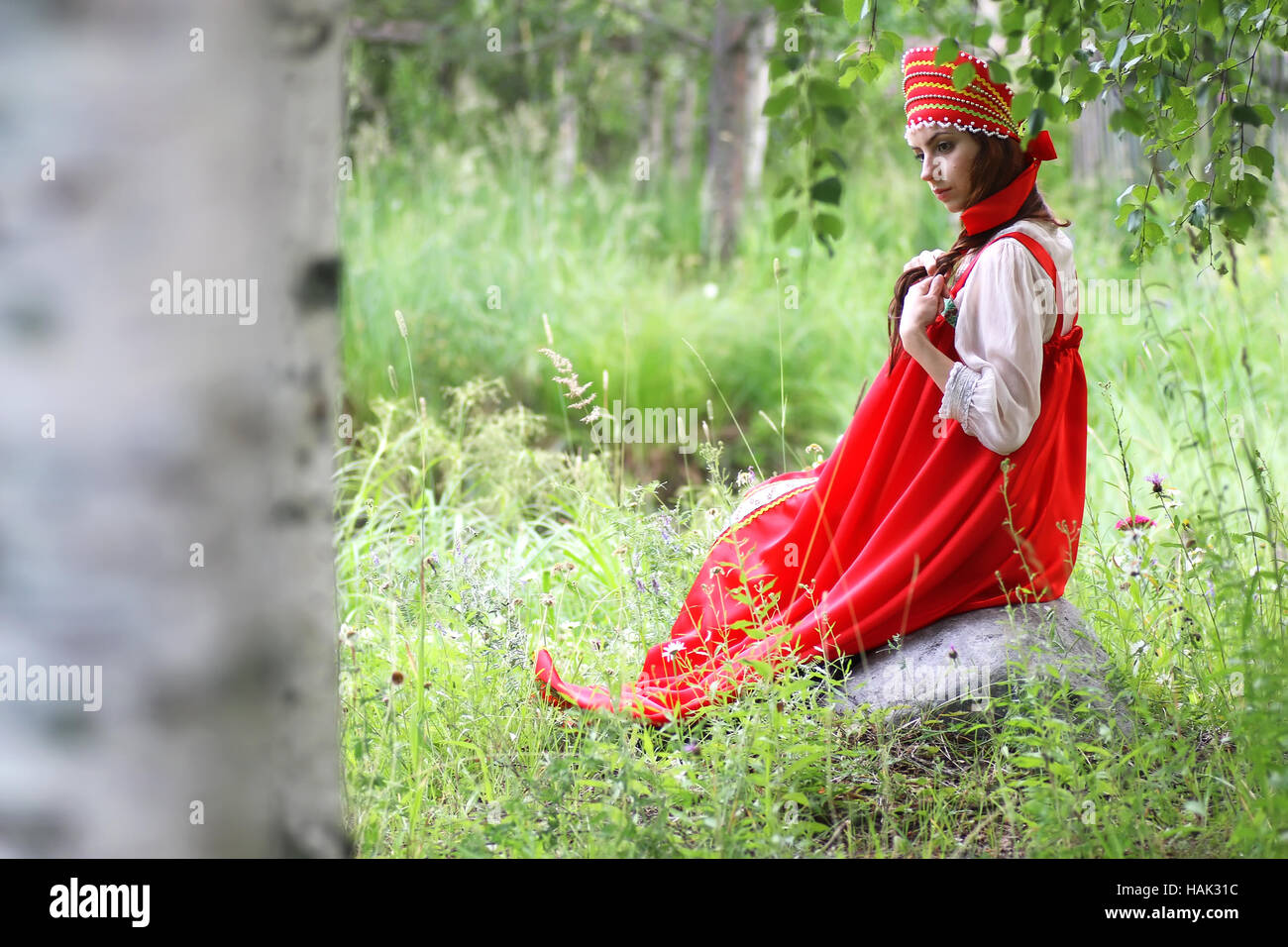 Slav in traditional dress is sitting in nature Stock Photo - Alamy