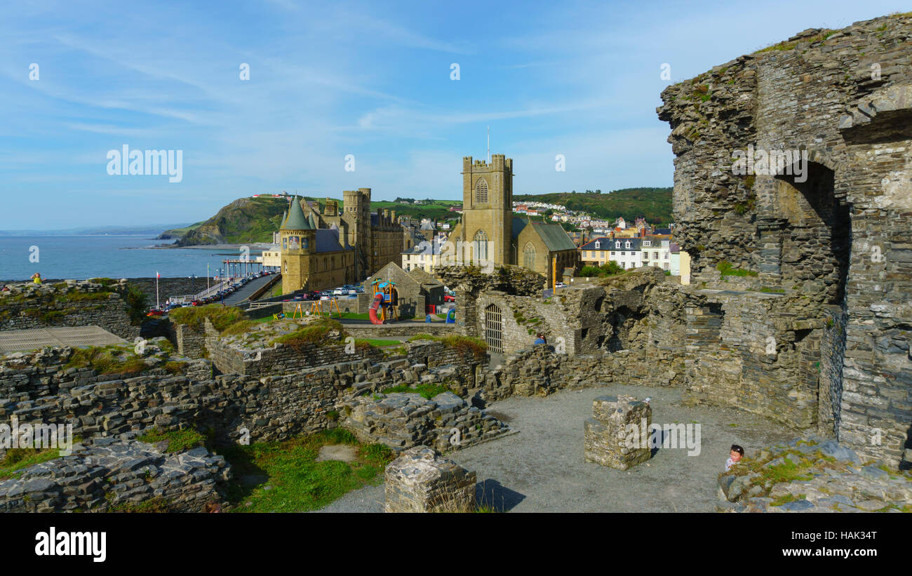 Amazing landscape with old castle ruins and new town on the ocean Stock ...