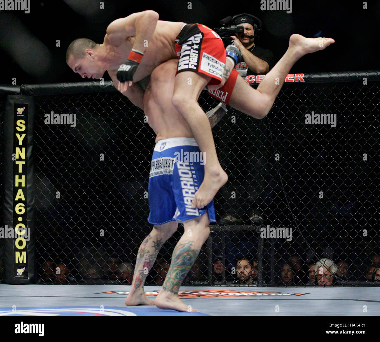 Kurt Pellegrino, blue shorts, slams Josh Neer during UFC 101 at the ...
