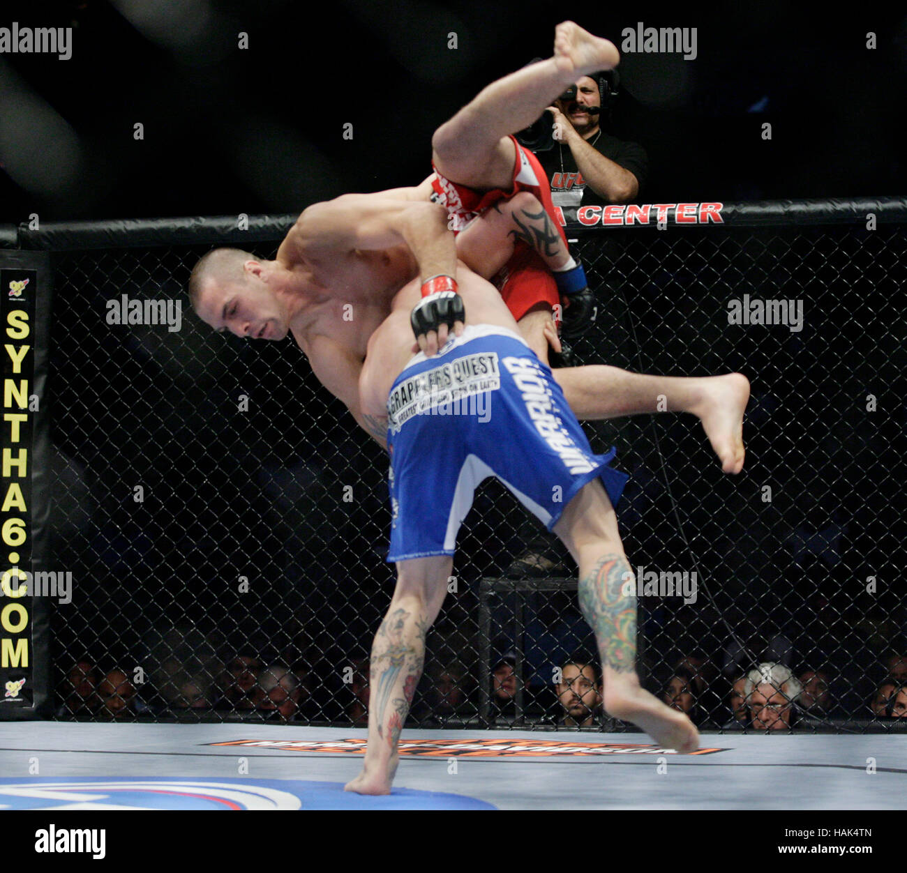 Kurt Pellegrino, blue shorts, slams Josh Neer during UFC 101 at the ...