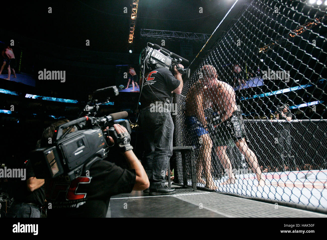 A UFC television crew records the Dan Cramer, left, Matthew Riddle ...