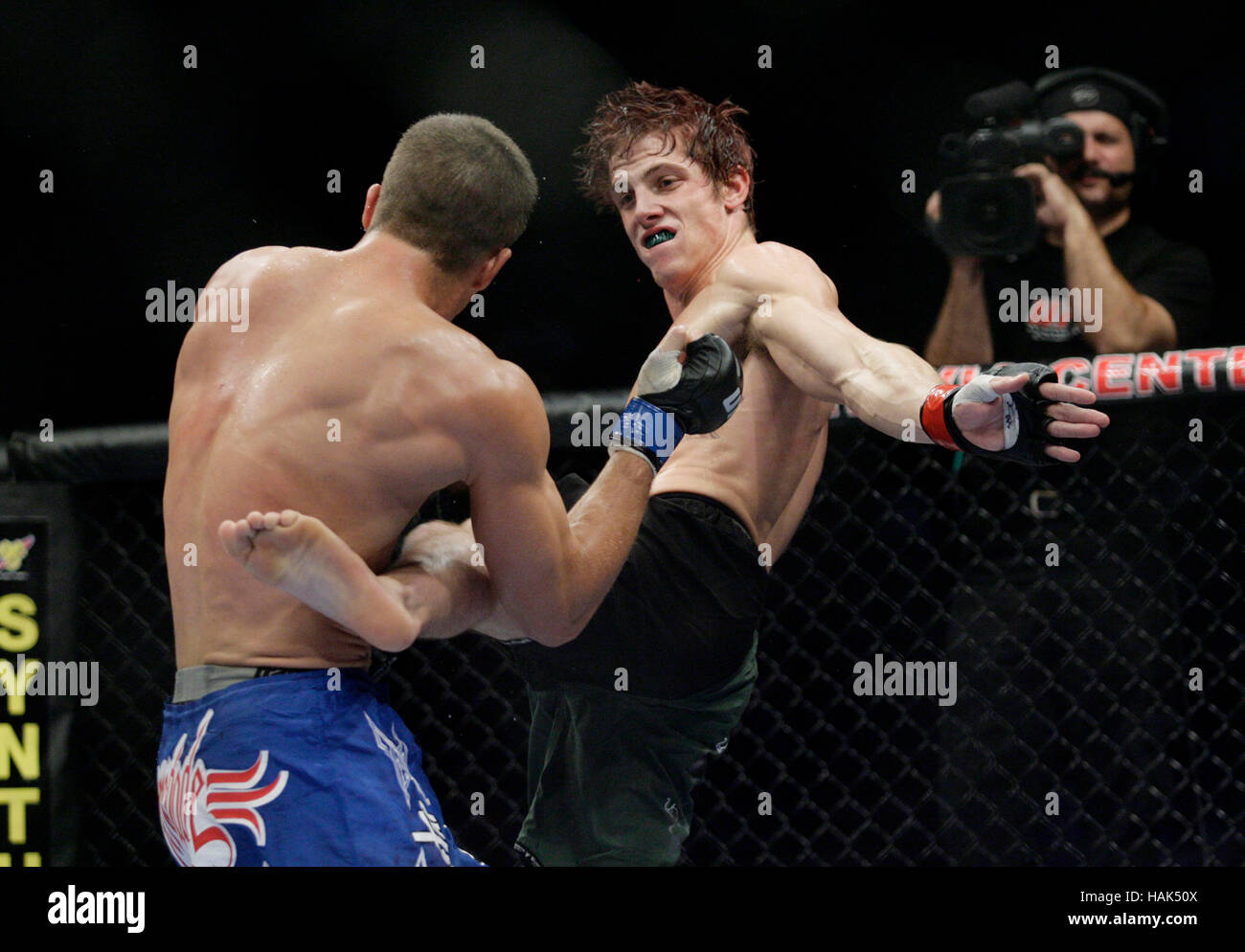 Dan Cramer, left, fights Matthew Riddle during UFC 101 at the Wachovia ...