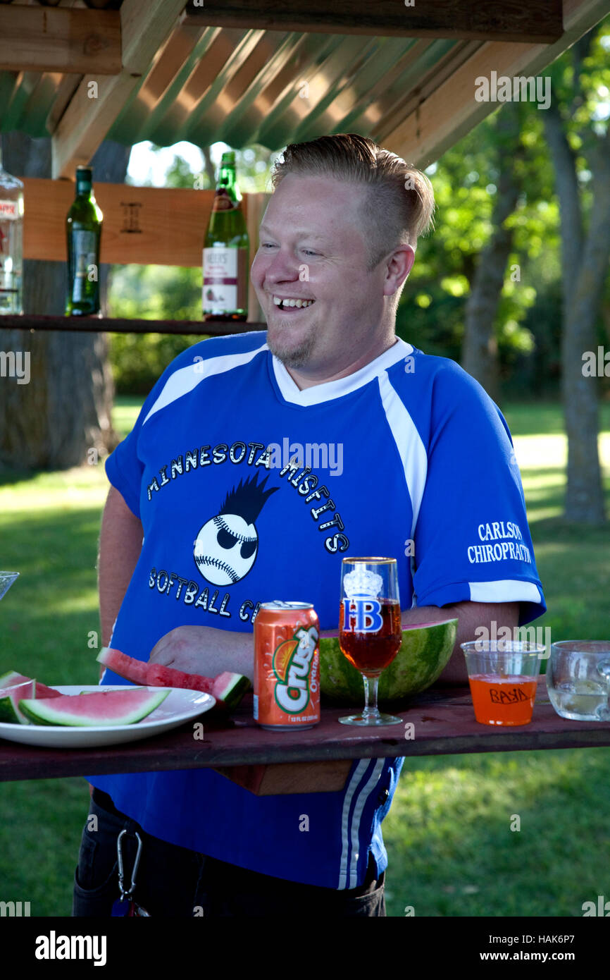 Man age 37 having a happy moment at a Key West style backyard bar ...
