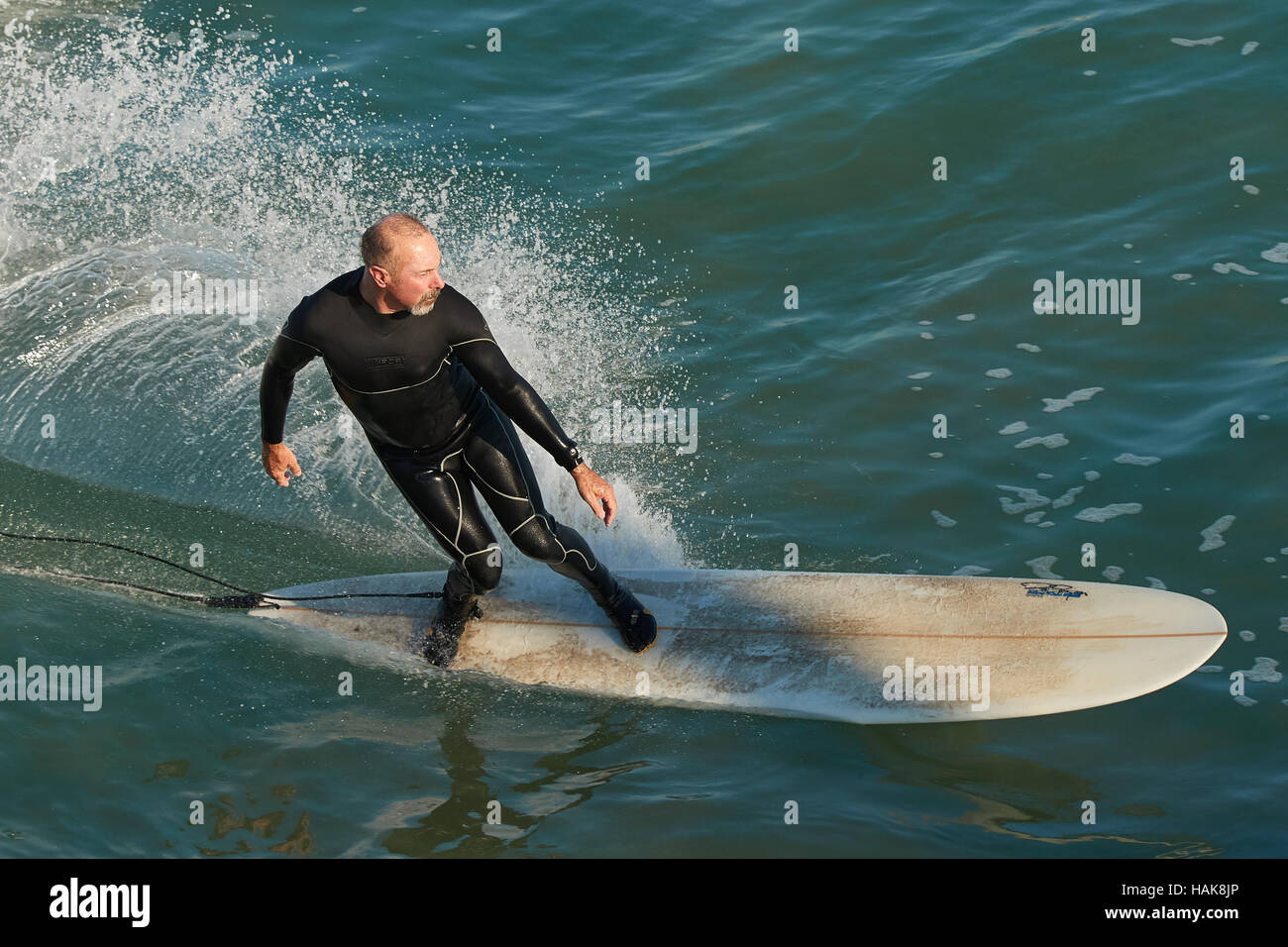 Side profile of a man surfing hi-res stock photography and images - Alamy