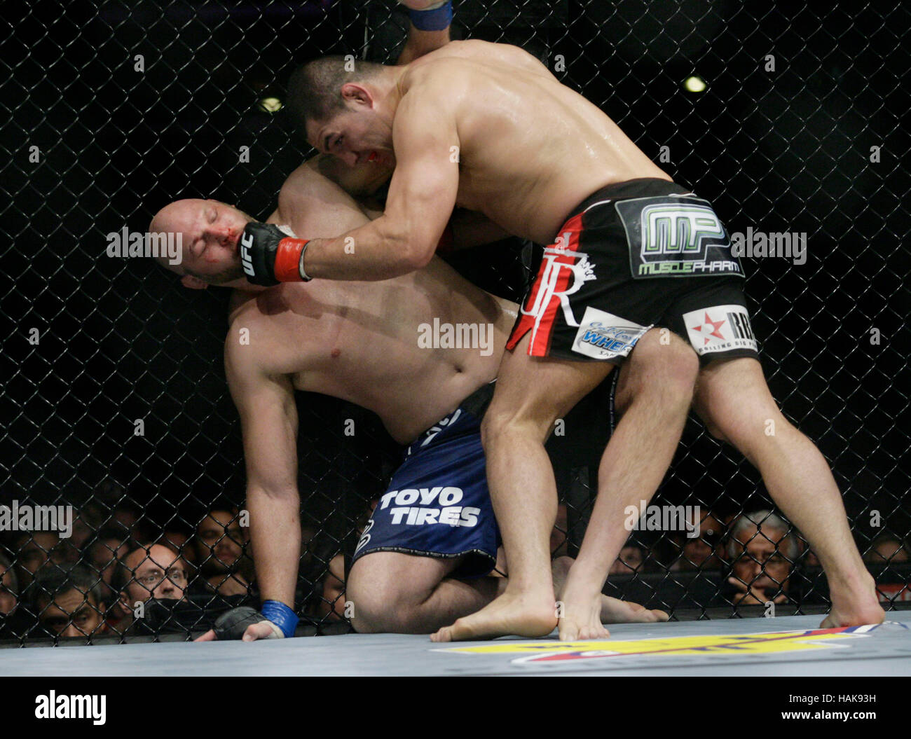 Cain Velasquez, right, fights Ben Rothwell at UFC 104 at the Staples ...