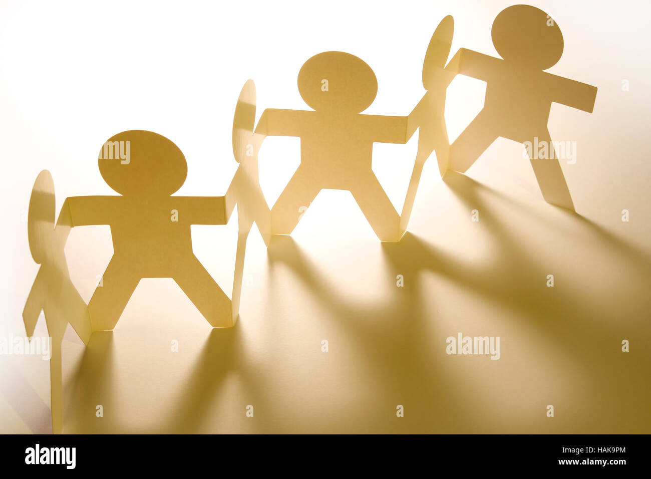 Team of paper doll people Stock Photo - Alamy