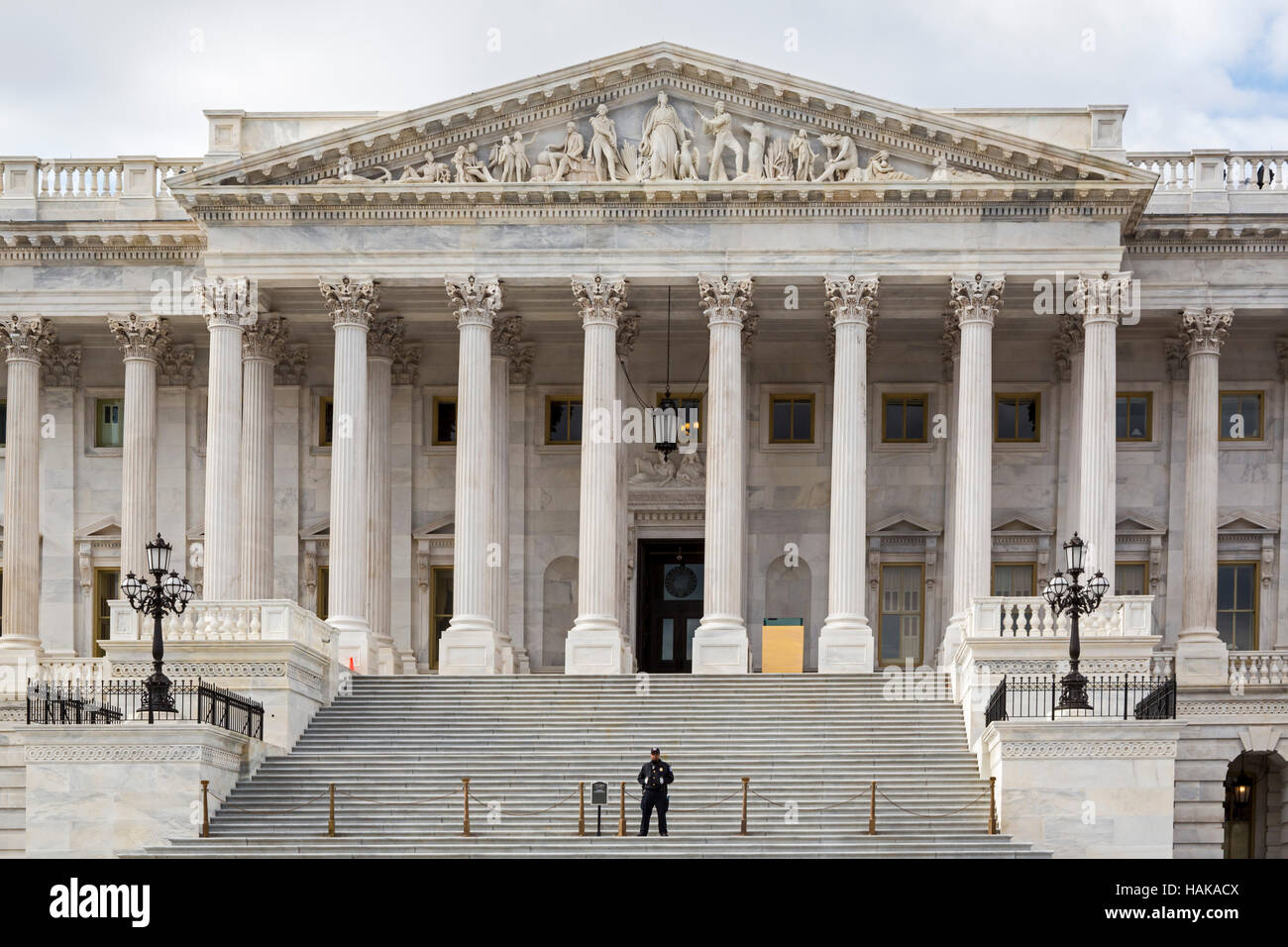 Washington, DC - A policeman guards the entrance to the Senate wing at ...