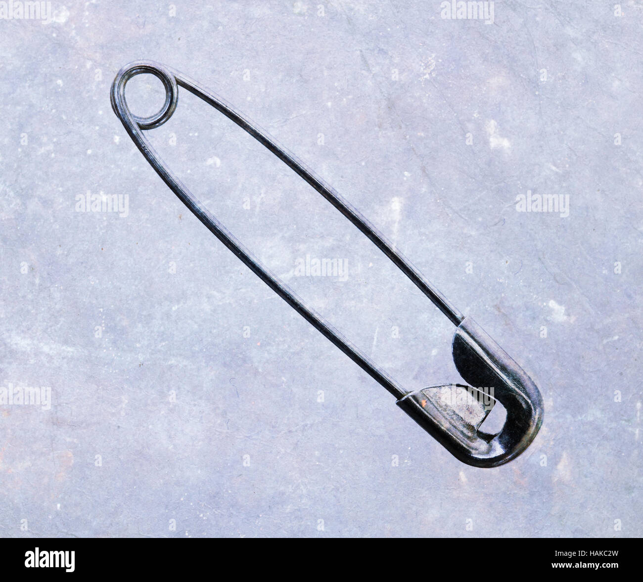 Regular safety pin on an isolated background Stock Photo - Alamy