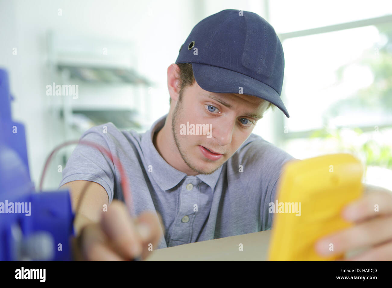 Man using multimeter Stock Photo - Alamy