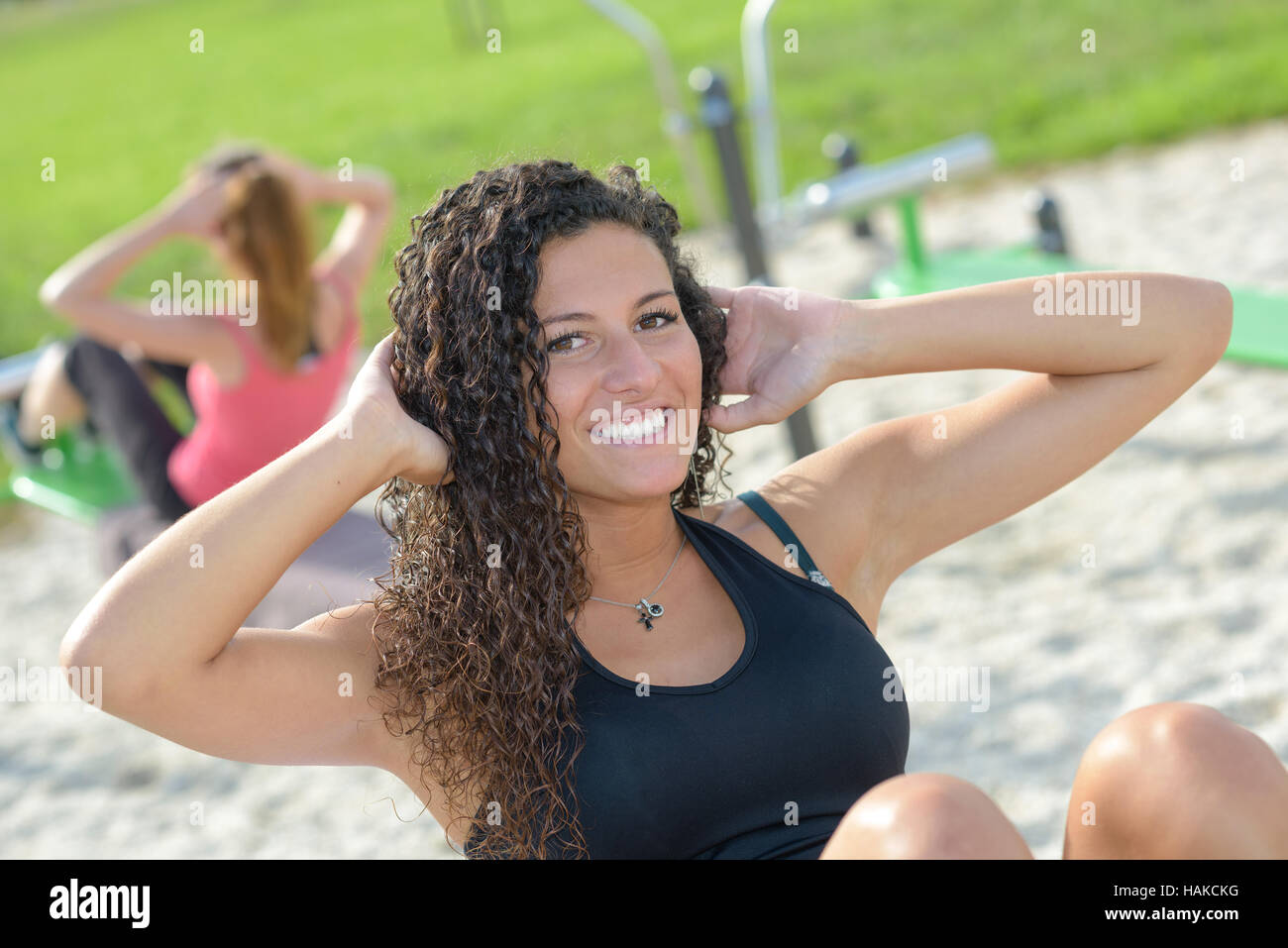 woman doing sit ups in outdoor gym Stock Photo - Alamy