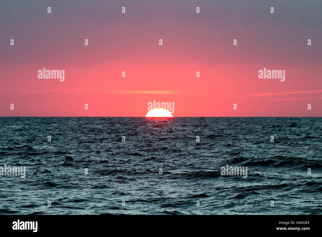 England, Broadstairs. Sun rising over the English Channel. Red sky. Sun ...