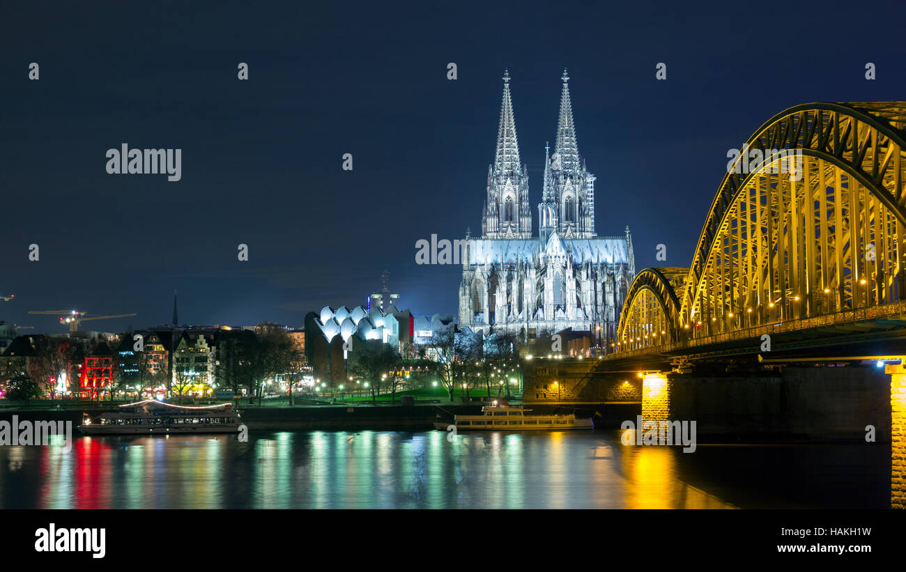 Riverside view of the Cologne Cathedral and railway bridge over the ...