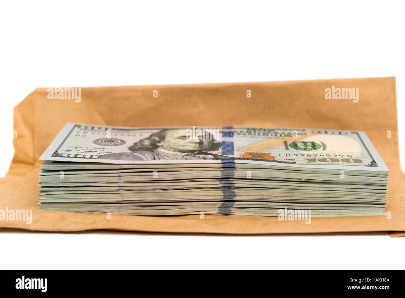 Isolated stack of hundred dollar bills on top of brown envelope Stock ...