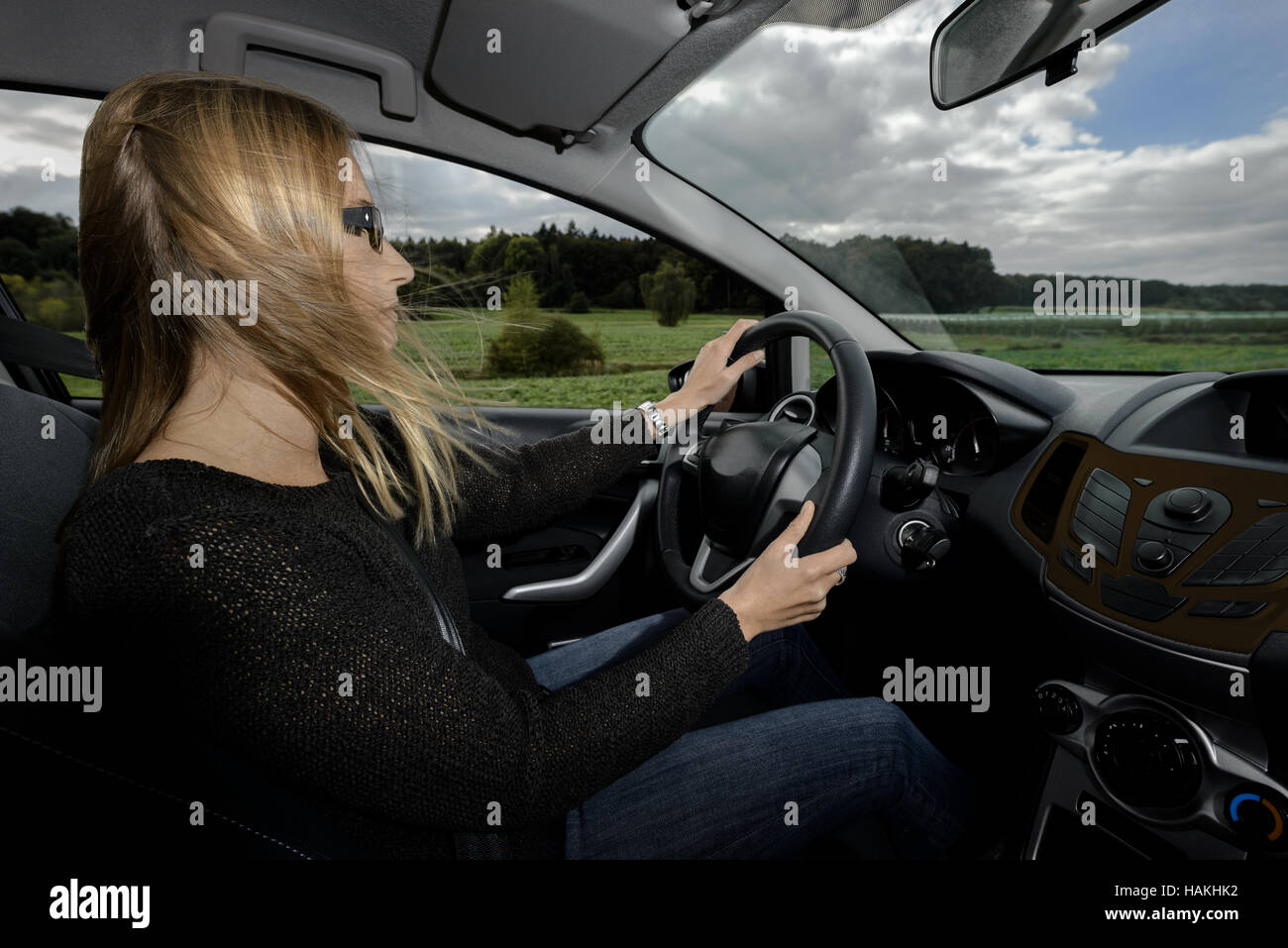 Woman steering car hi-res stock photography and images - Alamy