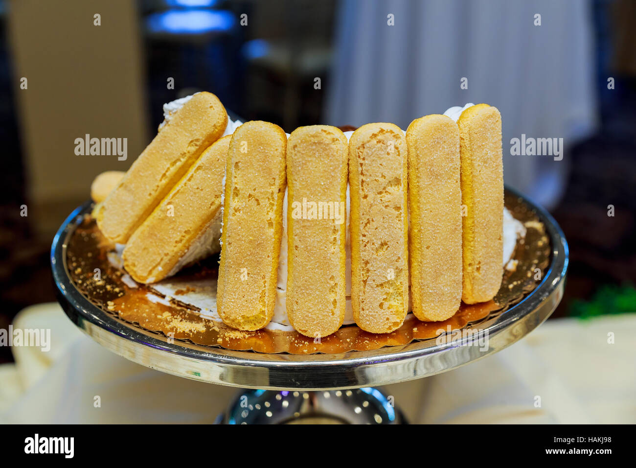 Wedding decoration with colorful eclairs, souffle, meringues, muffins ...