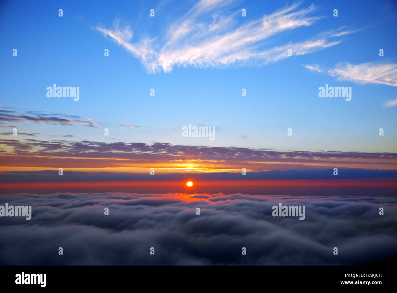 sunset above clouds Stock Photo - Alamy