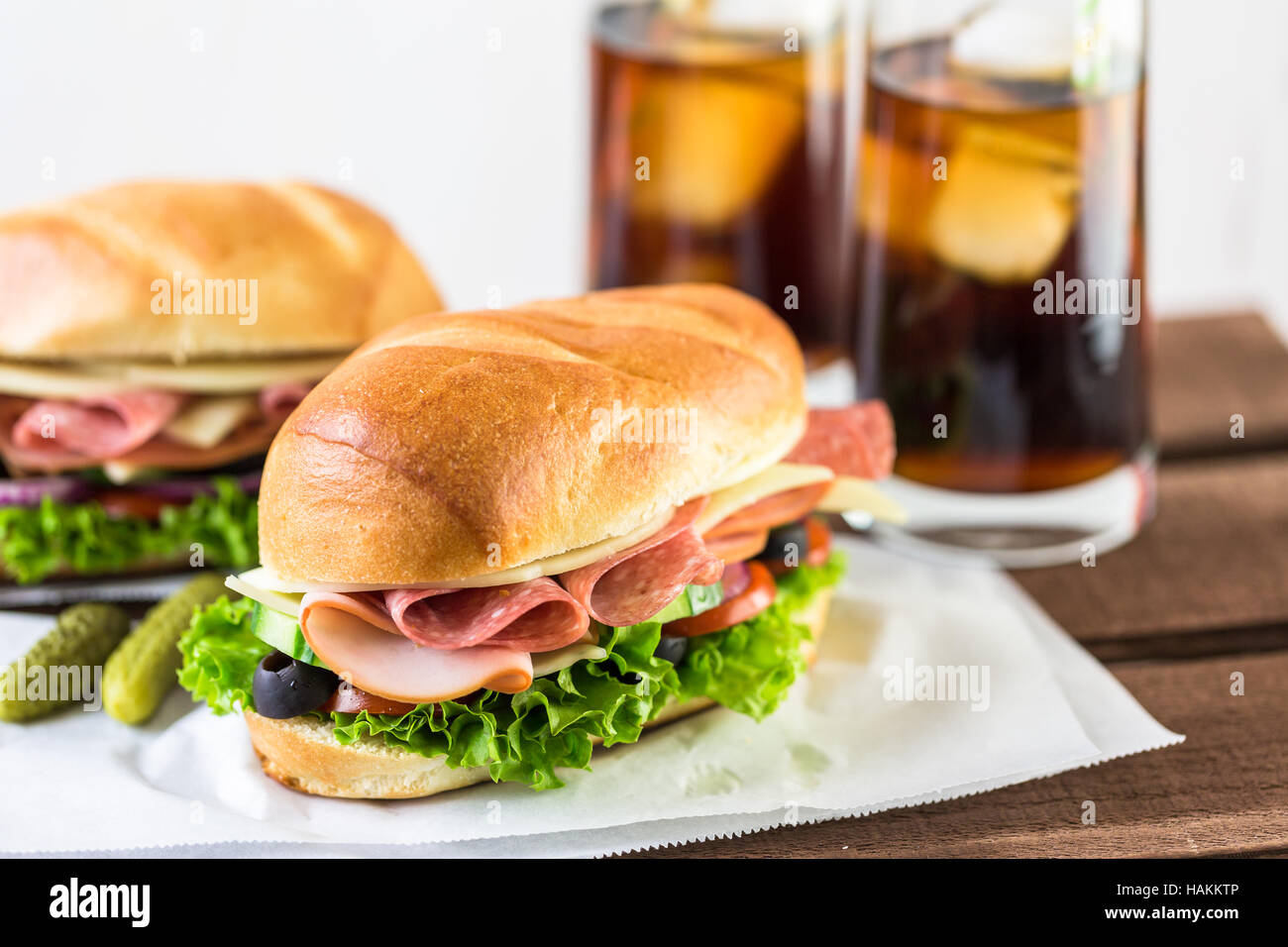 Sub sandwich with fresh vegetables, lunch meat and cheese on hoagie ...
