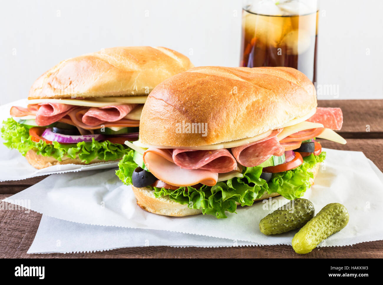 Sub sandwich with fresh vegetables, lunch meat and cheese on hoagie ...