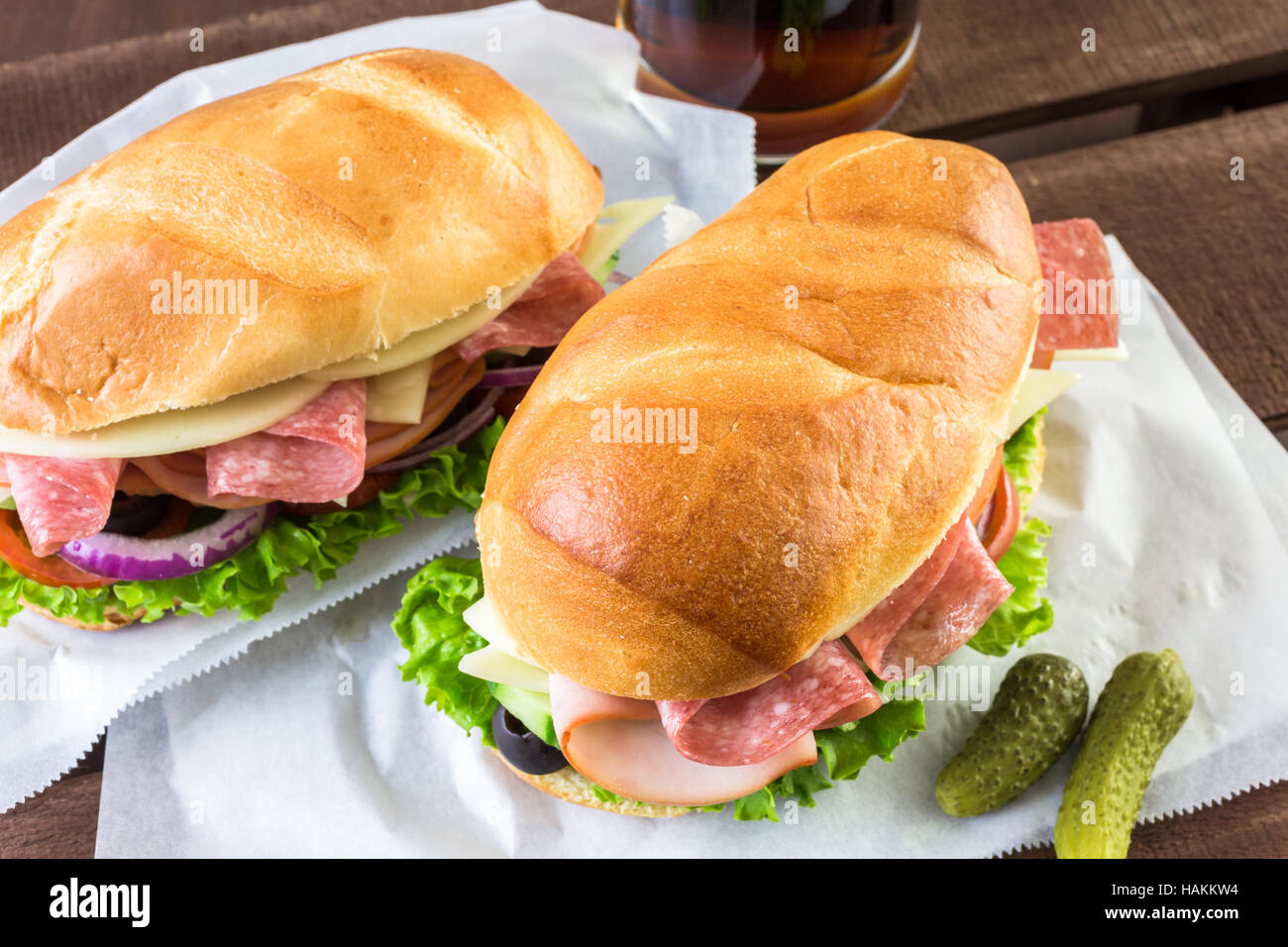 Sub sandwich with fresh vegetables, lunch meat and cheese on hoagie ...