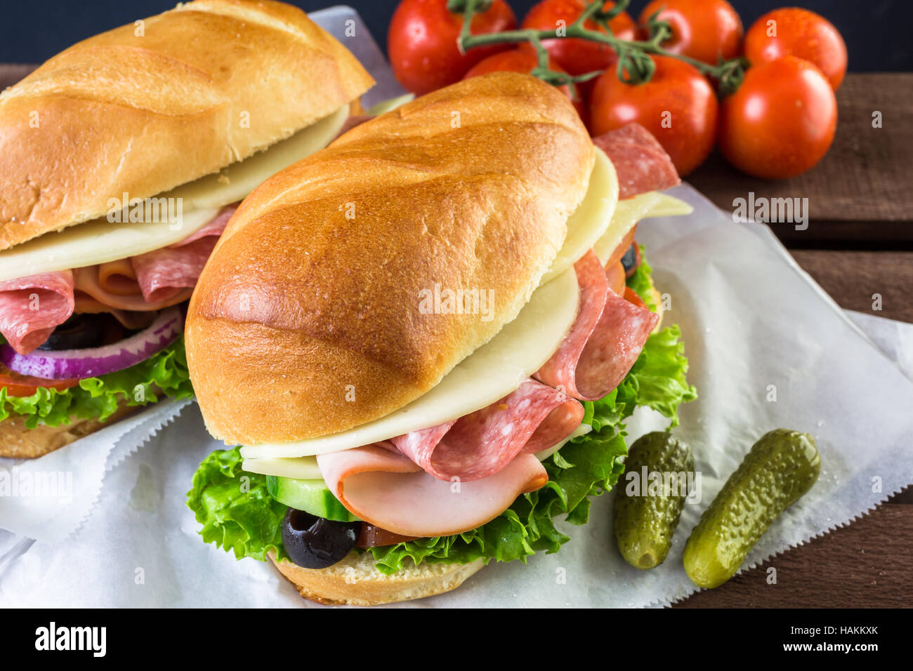 Sub sandwich with fresh vegetables, lunch meat and cheese on hoagie ...