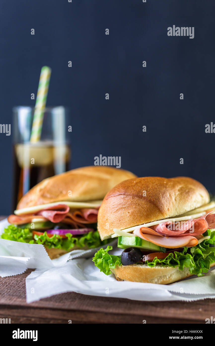 Sub sandwich with fresh vegetables, lunch meat and cheese on hoagie ...