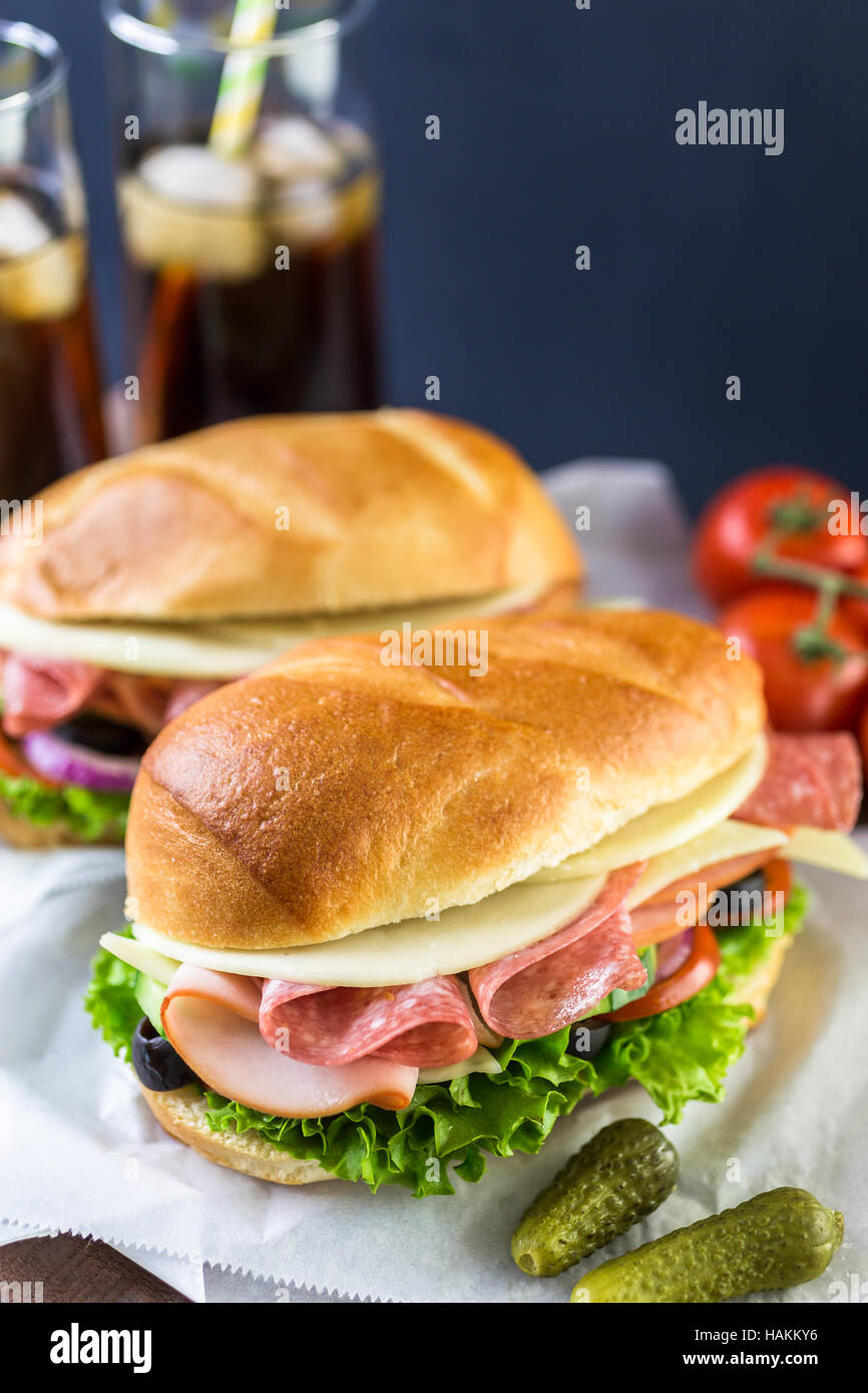 Sub sandwich with fresh vegetables, lunch meat and cheese on hoagie ...