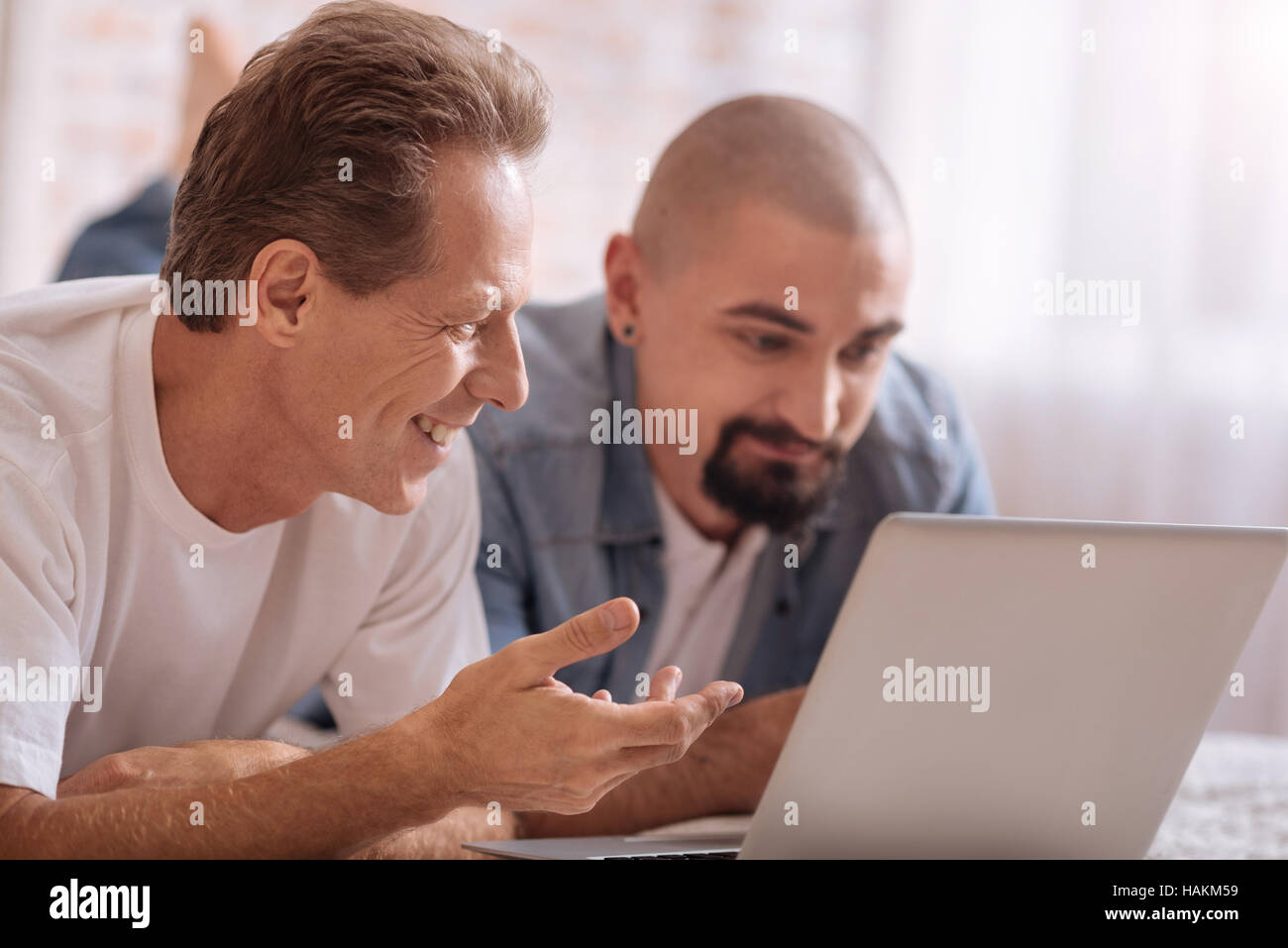 Involved friends surfing the Internet at home Stock Photo - Alamy