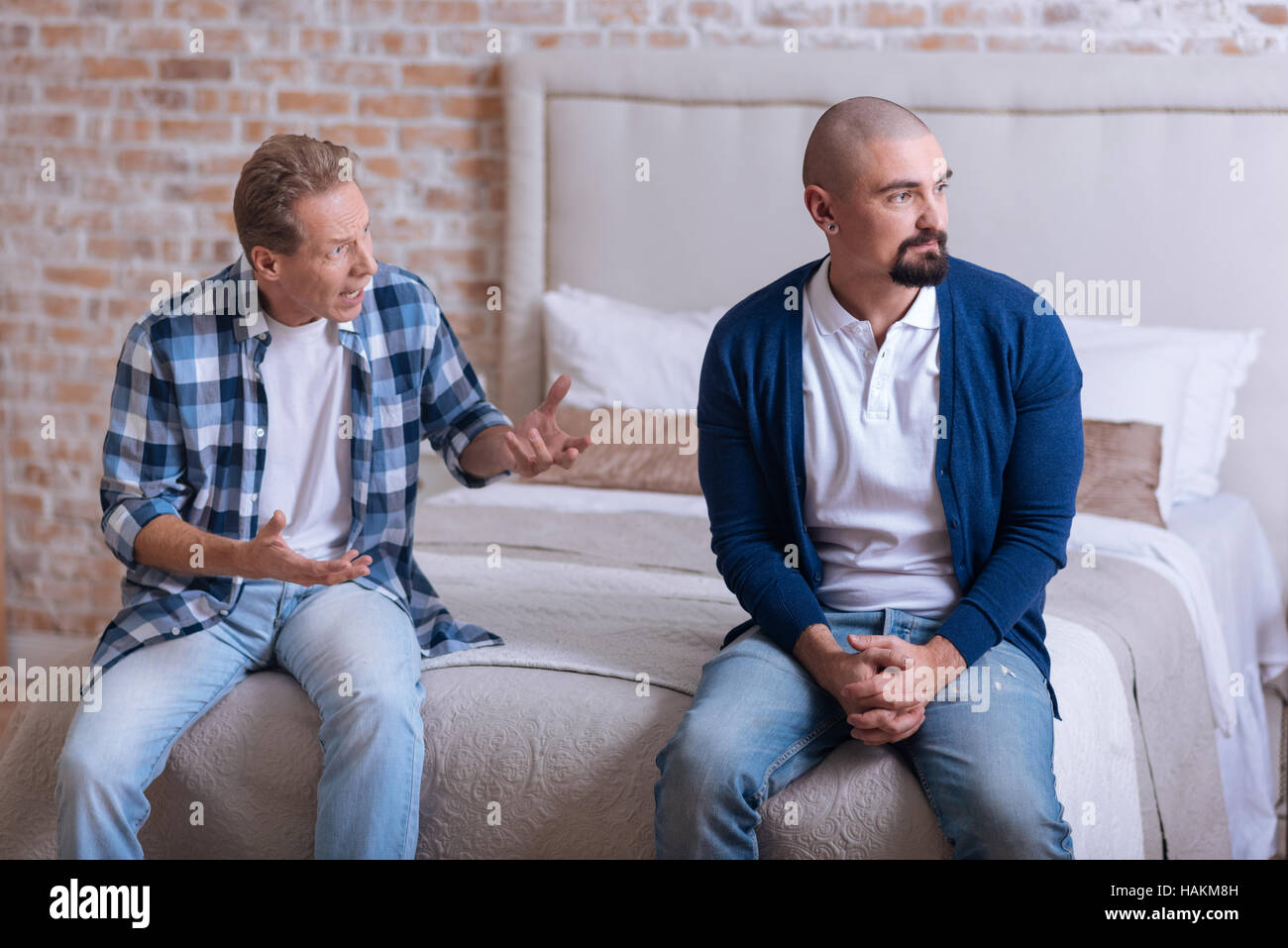 Furious man shouting on his son at home Stock Photo - Alamy