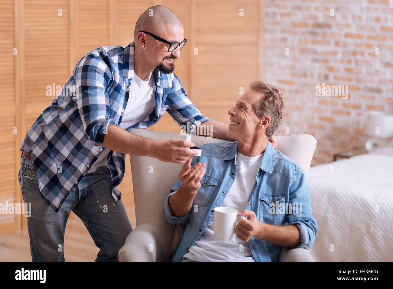 Happy young man making the proposal to his aged partner Stock Photo - Alamy