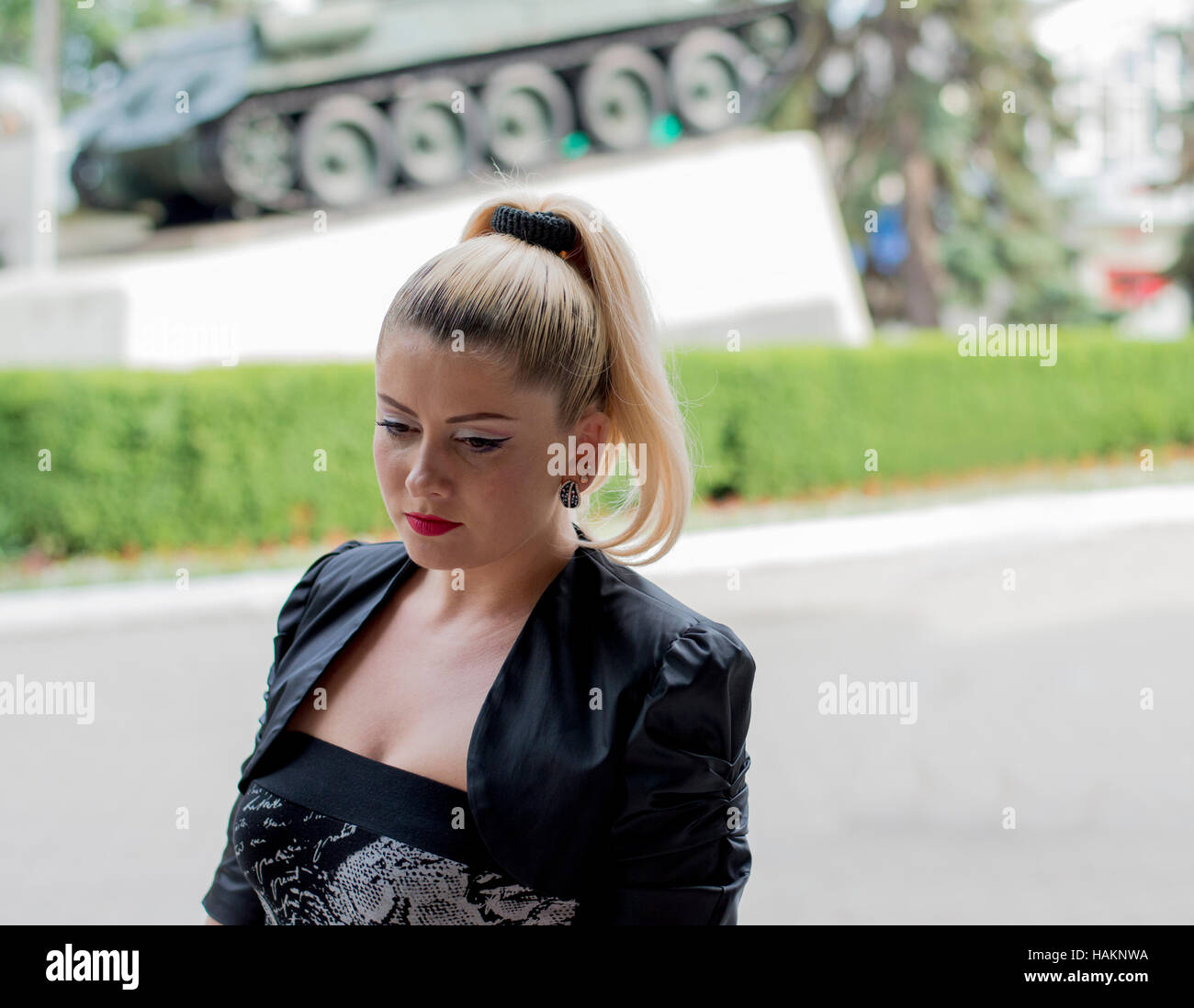 portrait of the sad woman against the background of the tank Stock ...