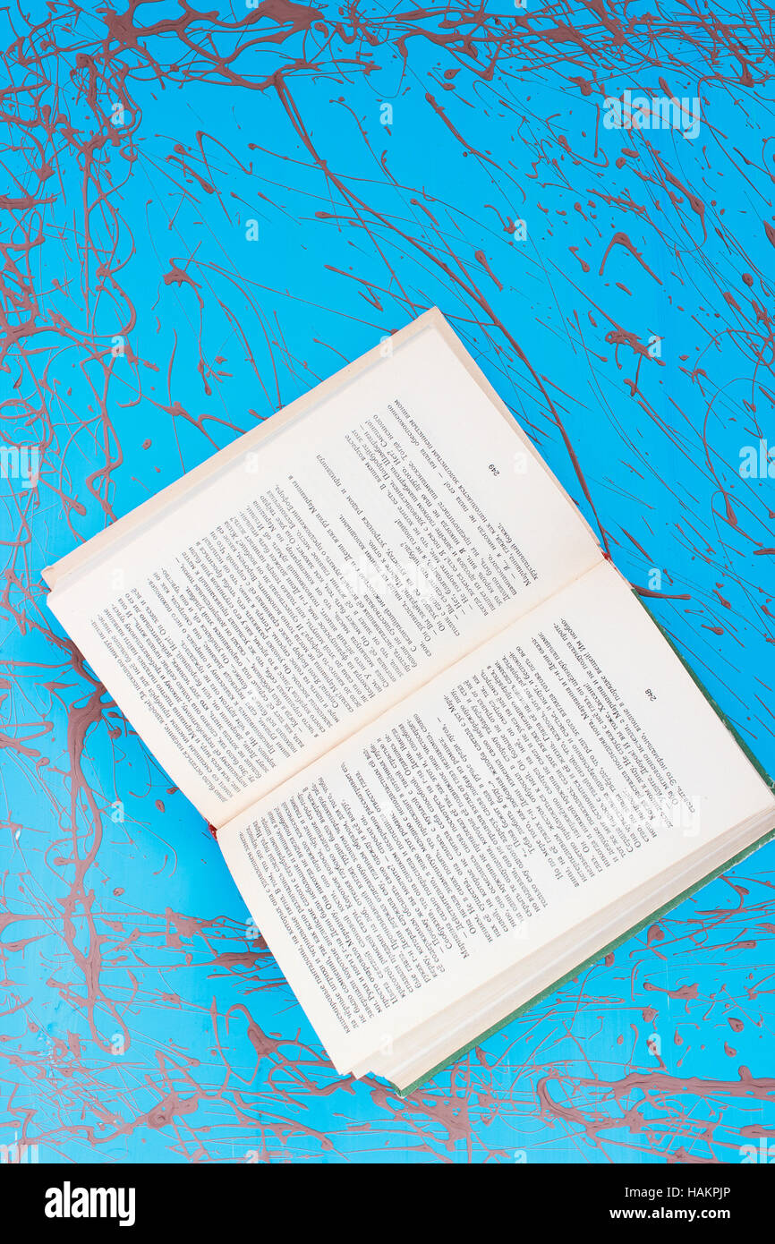 open book lying on a wooden table Stock Photo - Alamy