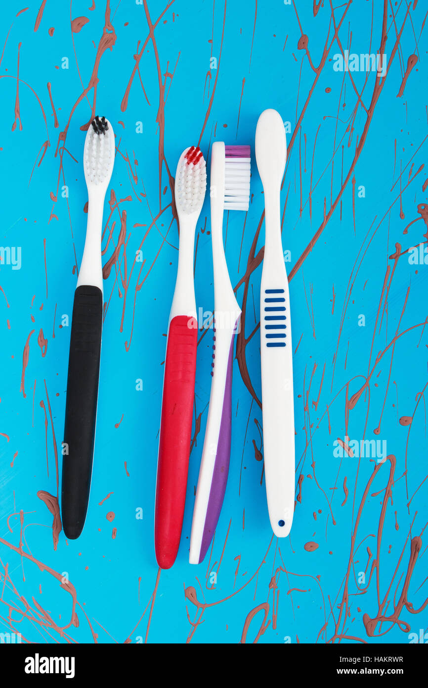 Manual toothbrush set isolated on blue background Stock Photo - Alamy